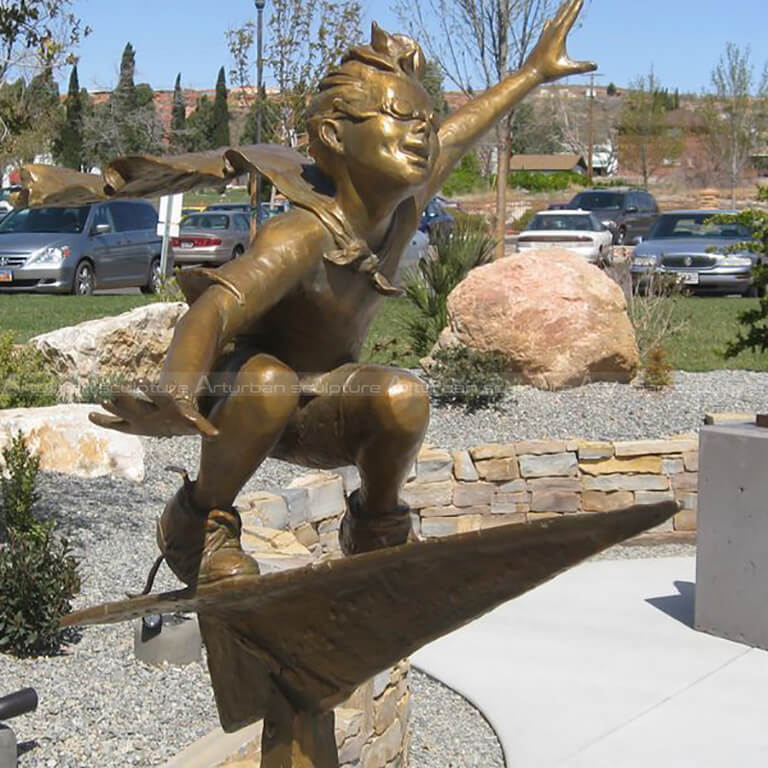 Boy Flying on Paper Airplane Statue