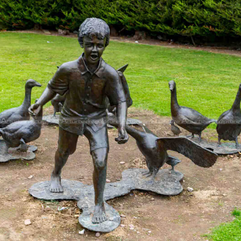 Boy and Geese Sculpture