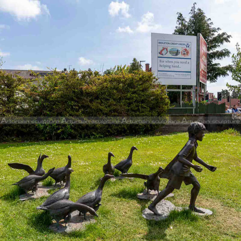 Boy and Geese Sculpture