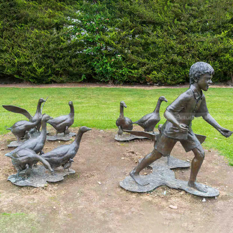 Boy and Geese Sculpture