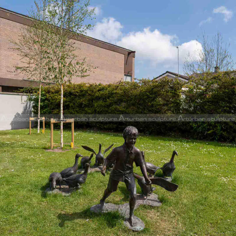 Boy and Geese Sculpture