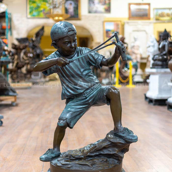 boy with slingshot sculpture - Arturban Statue